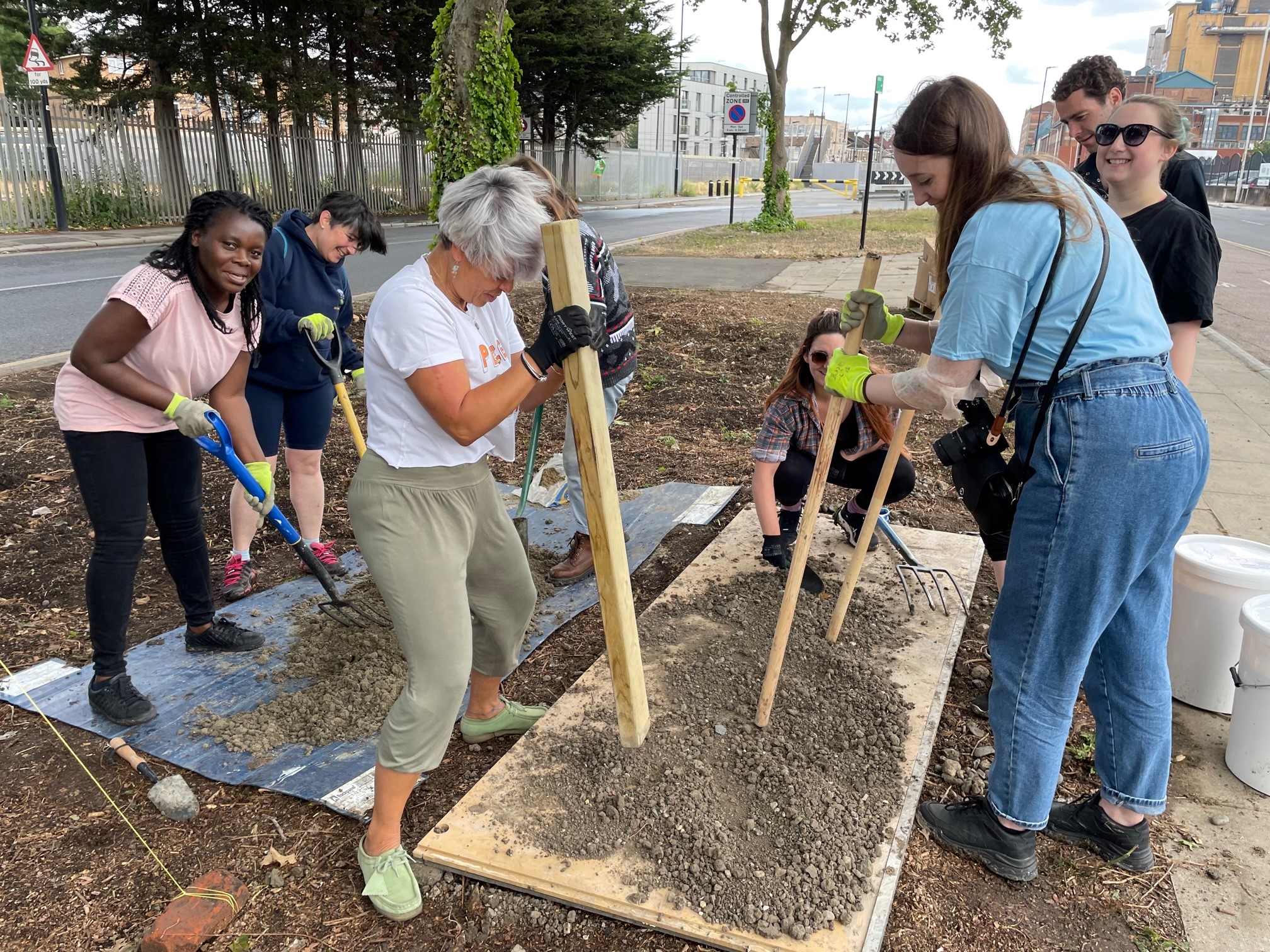 Volunteers transform a neglected green space into a community asset ...